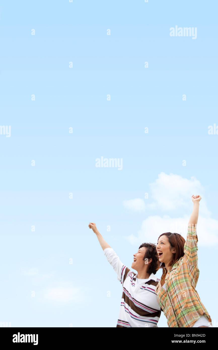 Young Man and Woman Punching the Air Stock Photo - Alamy
