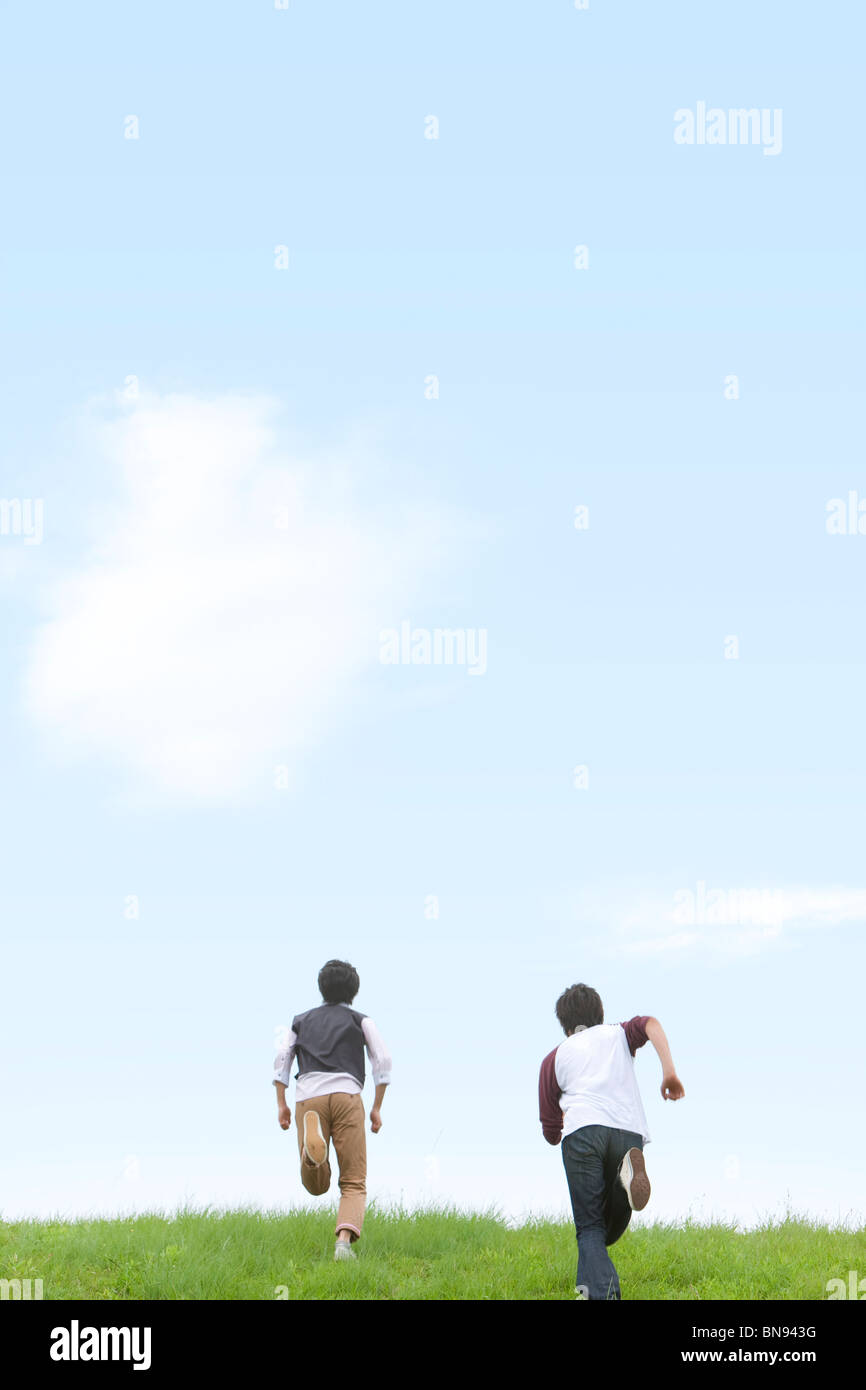 Two young men running Stock Photo - Alamy