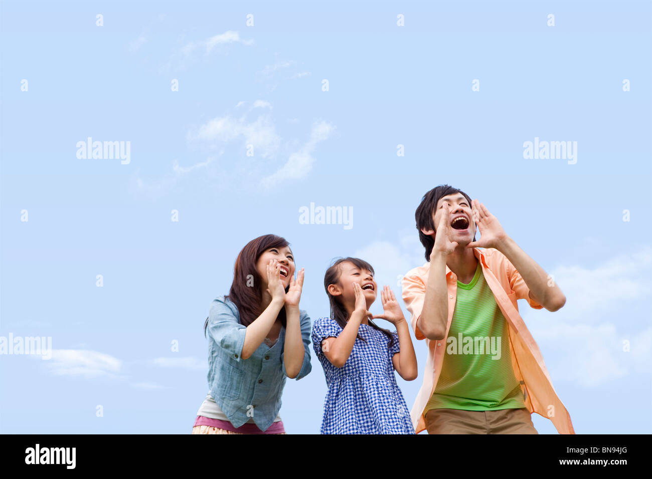 Family shouting under sky Stock Photo - Alamy