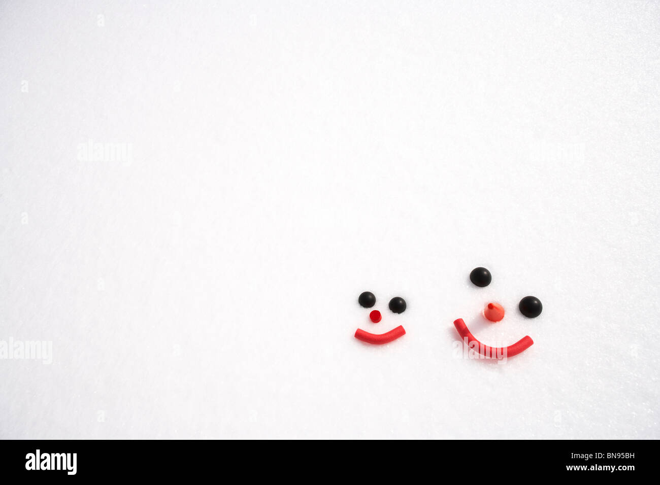 Happy faces in snow Stock Photo - Alamy