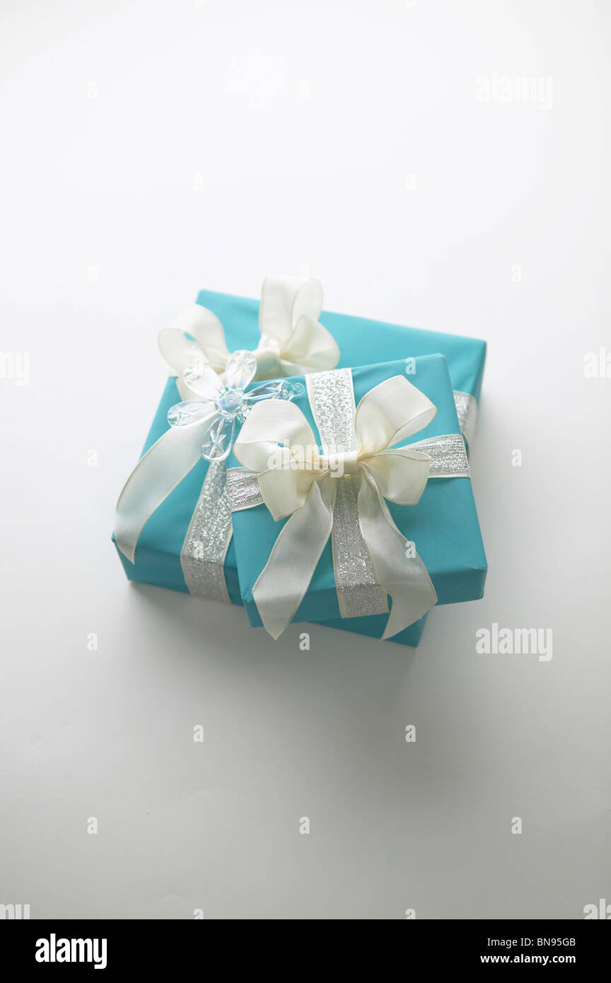 Blue present with white ribbon Stock Photo - Alamy