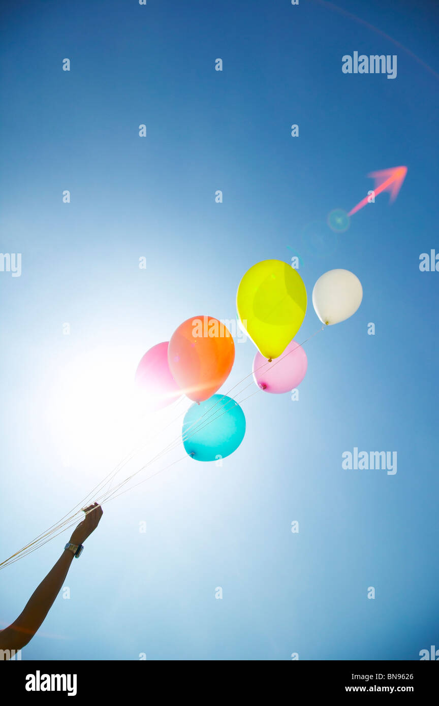 Hand releasing balloon hi-res stock photography and images - Alamy