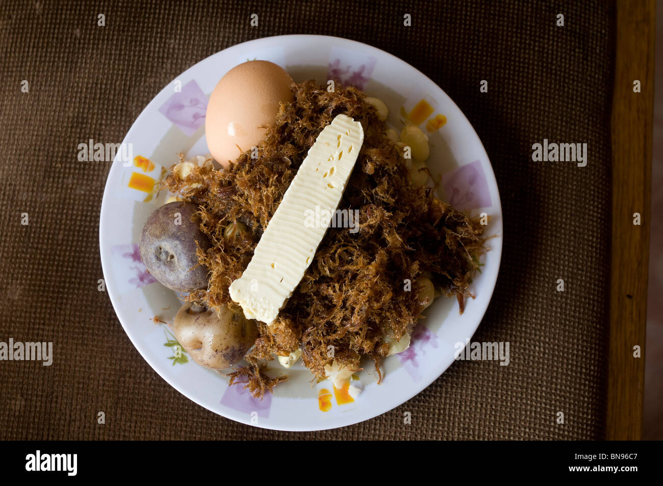 Traditional Bolivian altiplano meal of dried alpaca, cheese , egg and ...