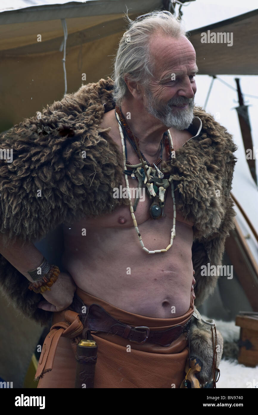Viking battle - festival, Moesgaard, Denmark 2009. Handsome viking with beard and necklaces of ...