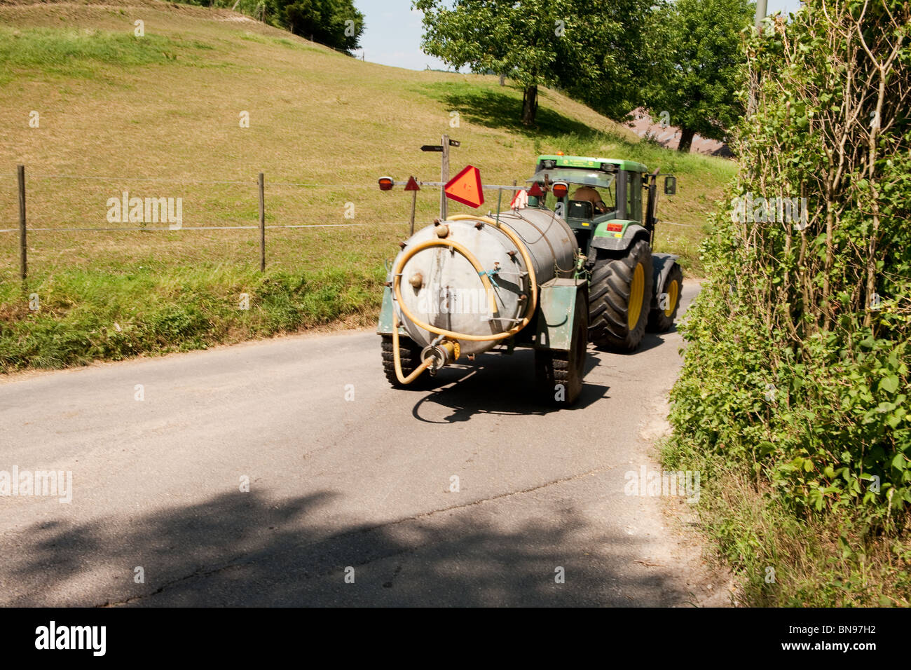 Driving liquid manure with tractor Stock Photo - Alamy