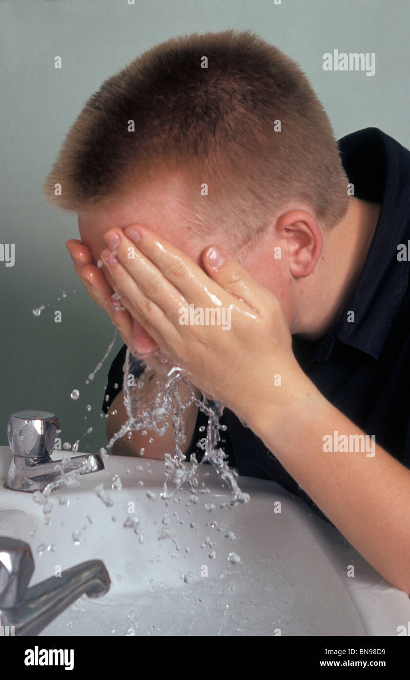 Boy washing face hi-res stock photography and images - Alamy