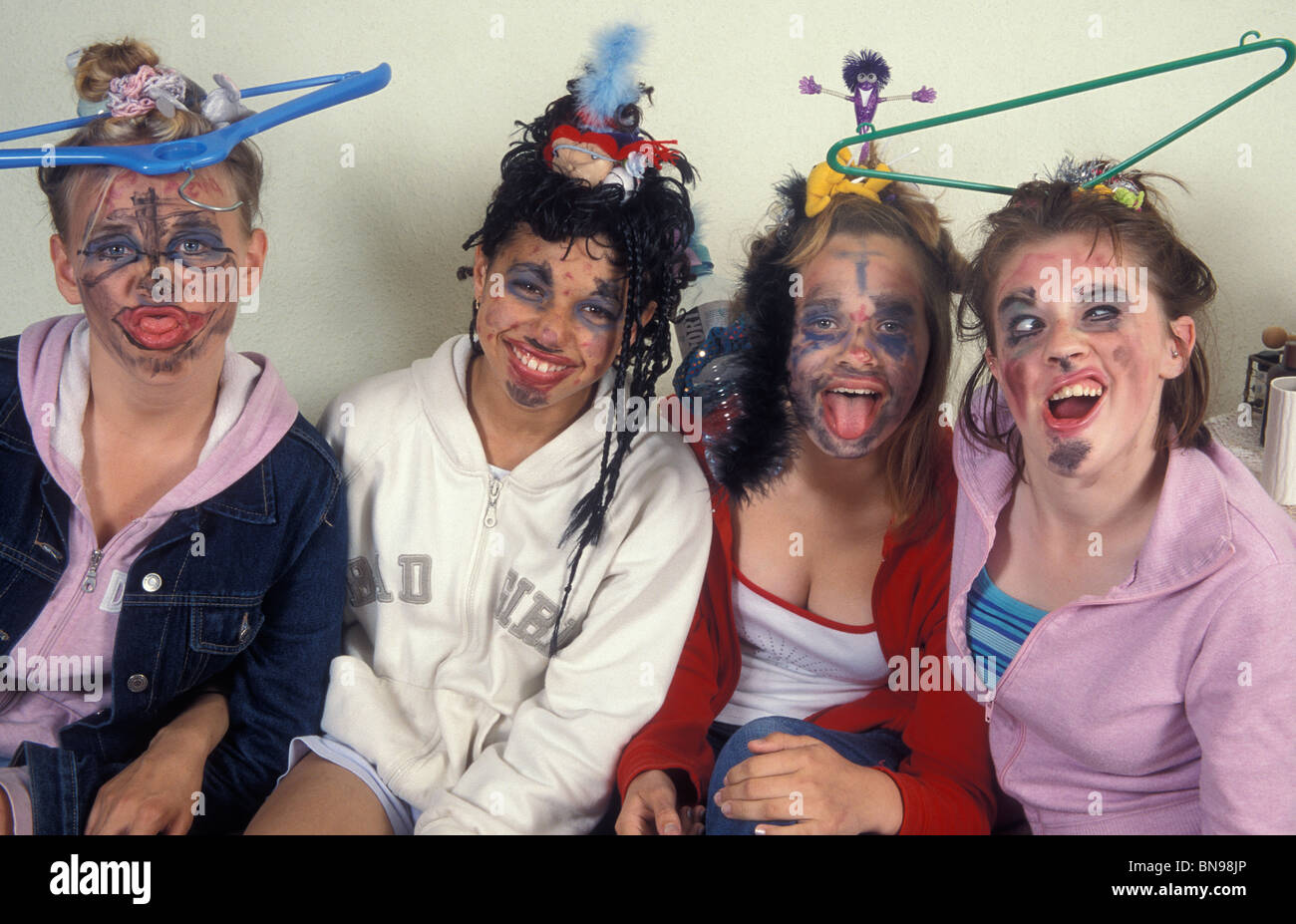 portrait four teenage girls in crazy fancy dress Stock Photo - Alamy