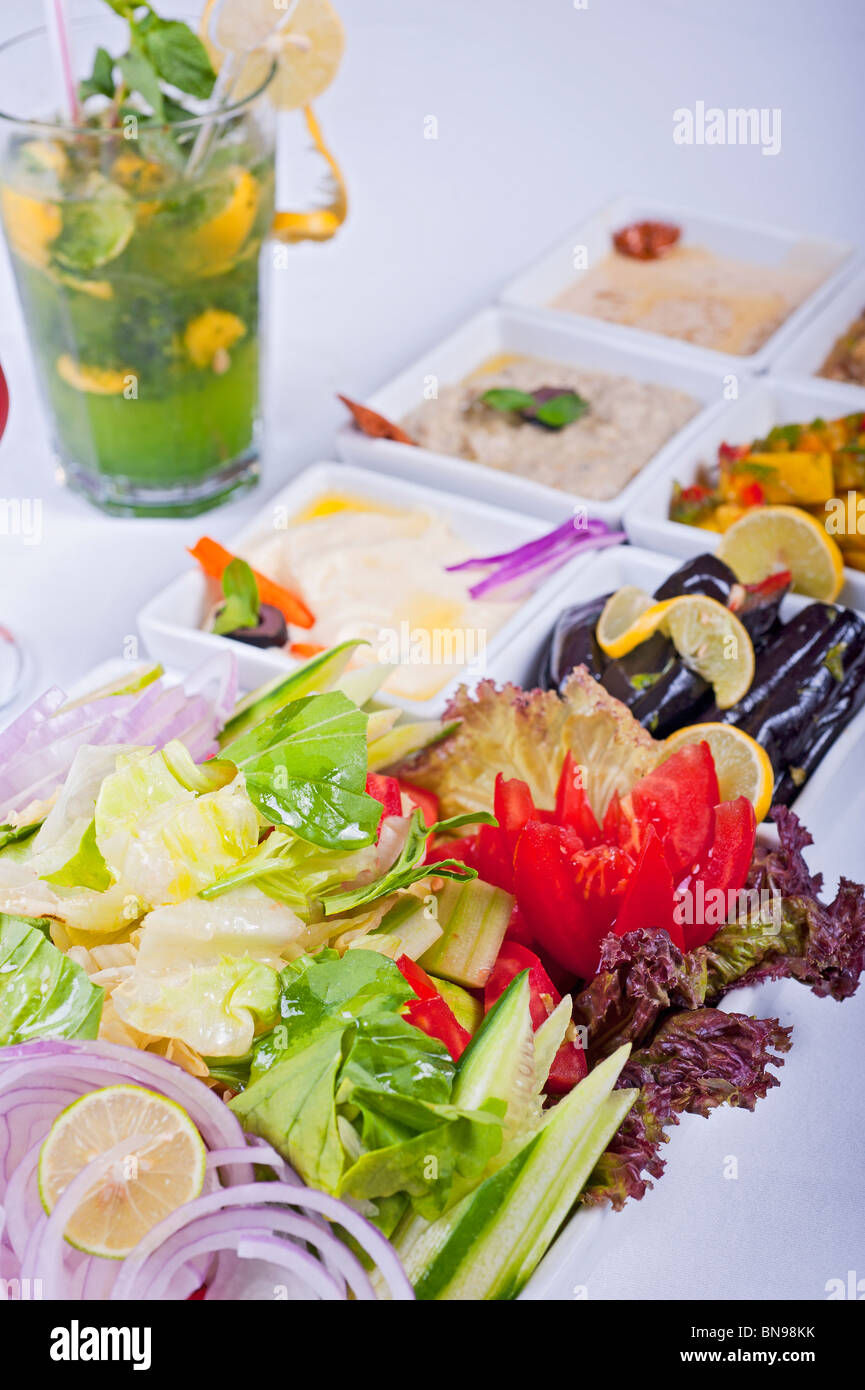 Selection of fresh salad dishes in bowls on a table in a restaurant ...