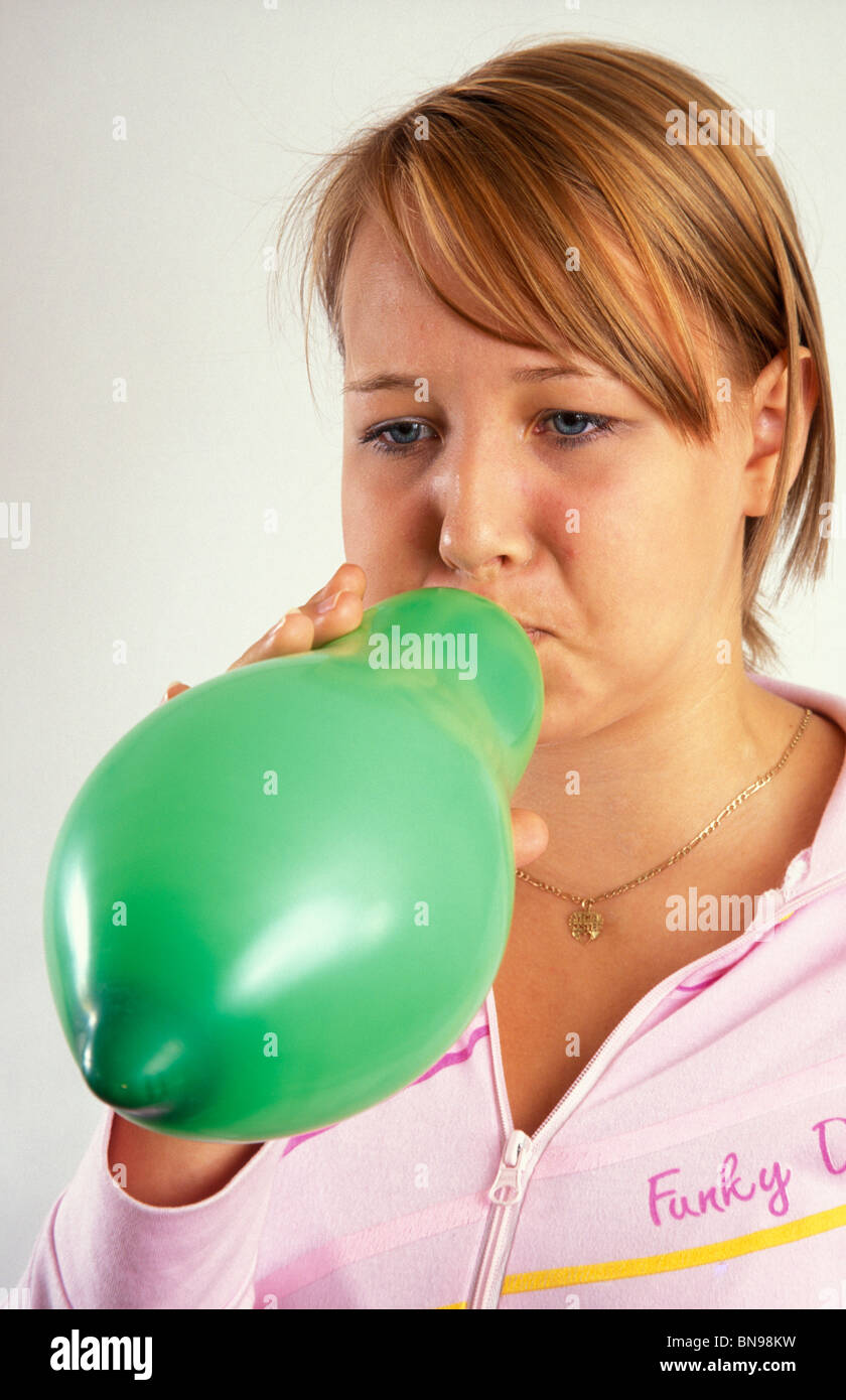 Teenage girl inflating balloon hi-res stock photography and images - Alamy