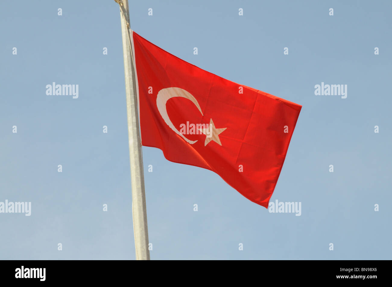 Turkish national flag blowing from a flagpole Stock Photo - Alamy