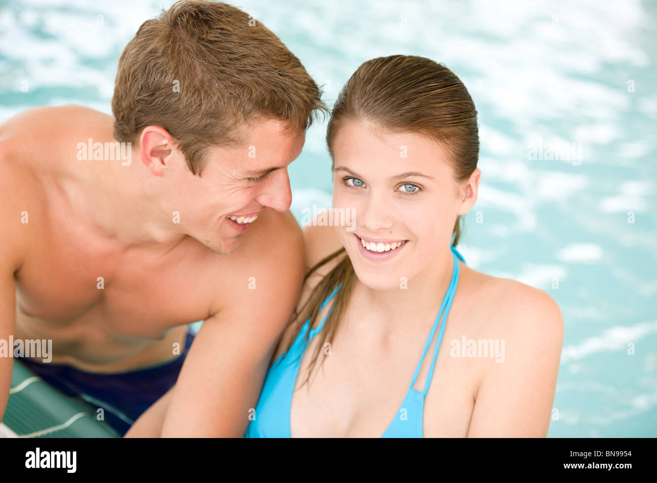 Young loving couple have fun in swimming pool in luxury hotel Stock Photo - Alamy