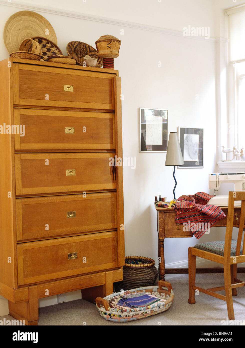 Tall modern chest-of-drawers in townhouse study bedroom Stock Photo - Alamy