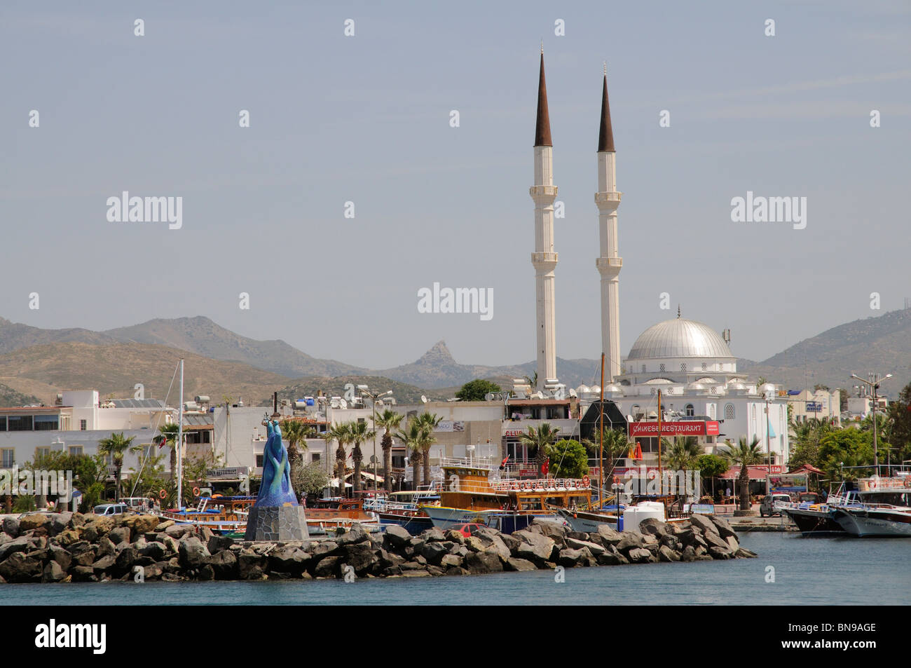 Turkish Mosque overlooks the harbour in the coastal resort & port of ...