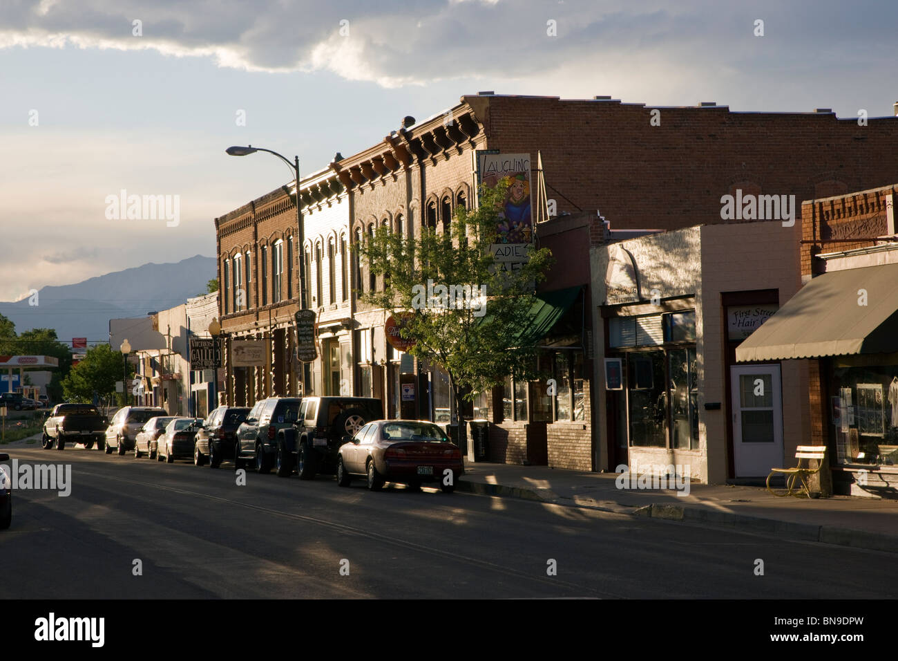 Sunset light reflecting off historic buildings in the small mountain ...