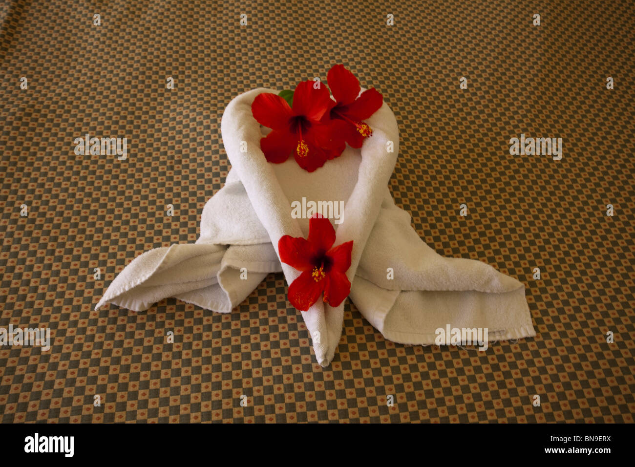 love heart shaped towel on bed Stock Photo - Alamy