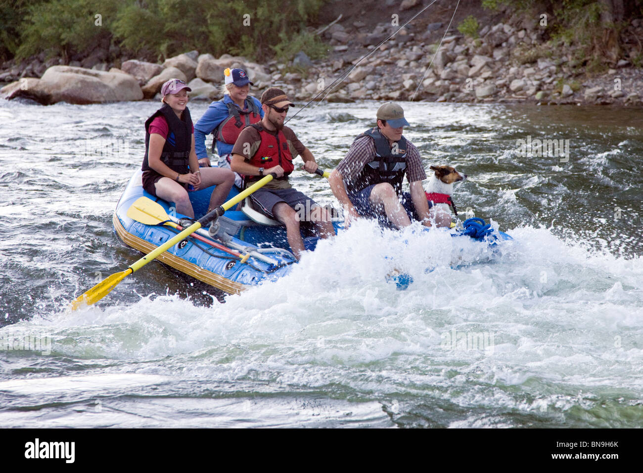 Rafters float down the Arkansas River through the small mountain town ...