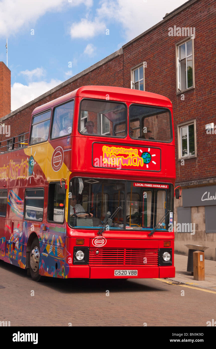 The city sight seeing double decker red bus showing movement in Norwich ...