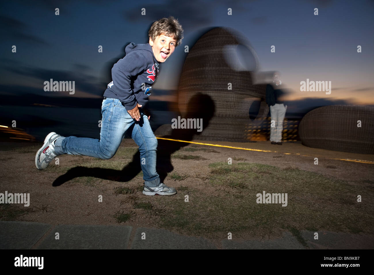 boy running at twilight Stock Photo - Alamy