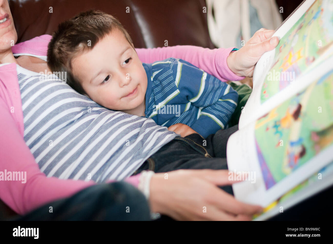 Mother reading bedtime stories to child Stock Photo - Alamy