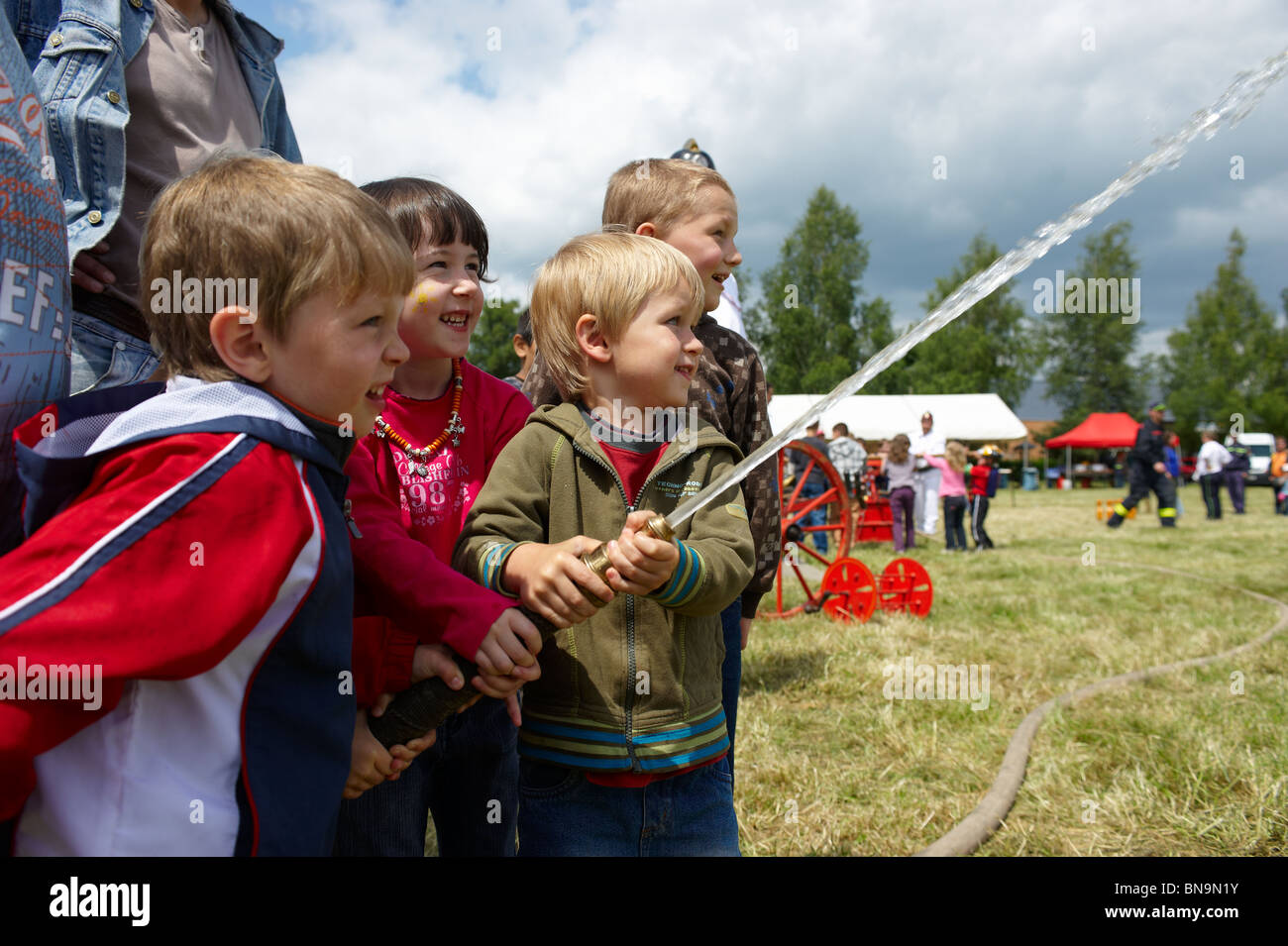 Young child boy playing fire fighter Stock Photo - Alamy