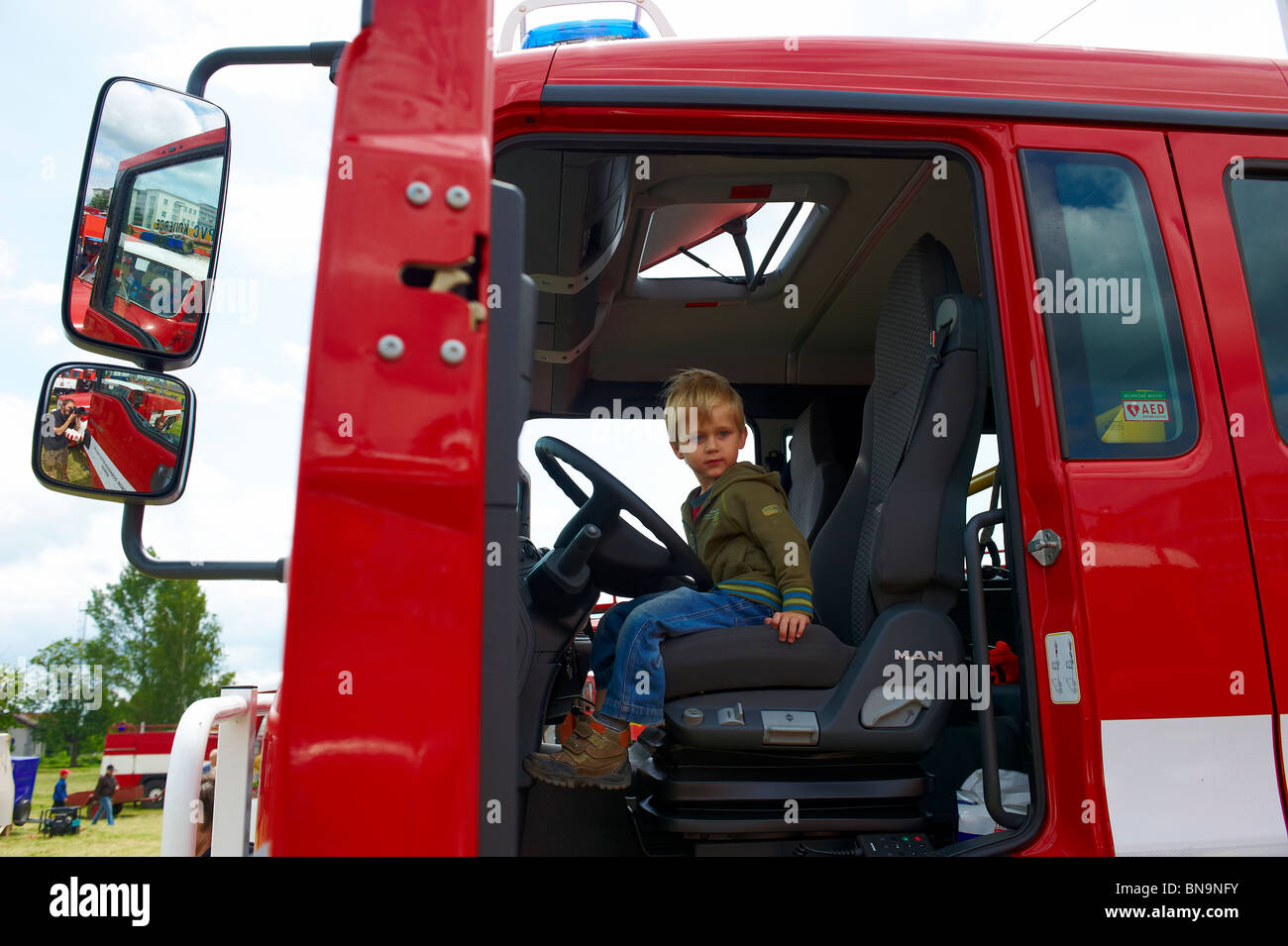 Young child boy playing fire fighter Stock Photo - Alamy