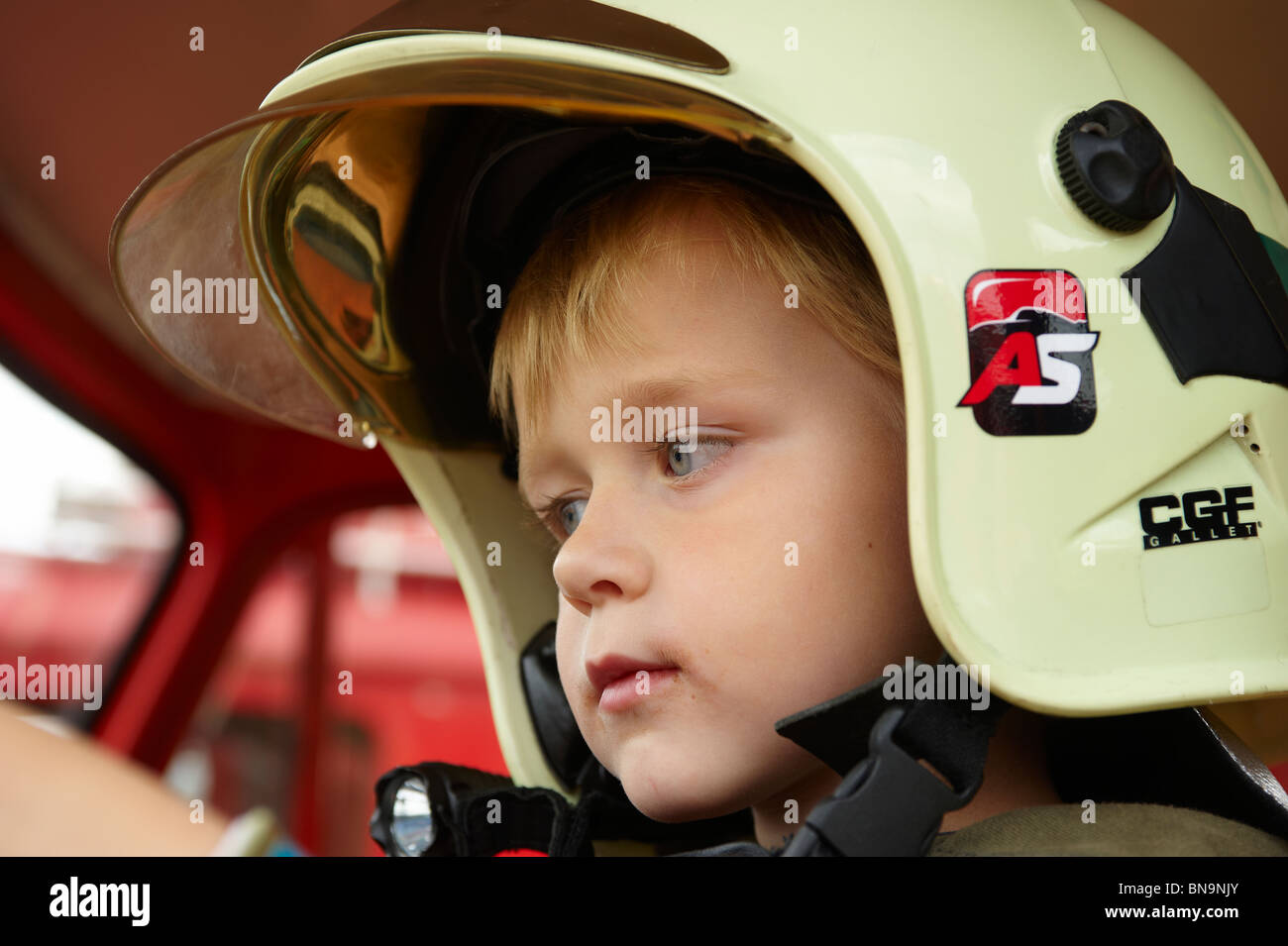 Young child boy playing fire fighter Stock Photo - Alamy