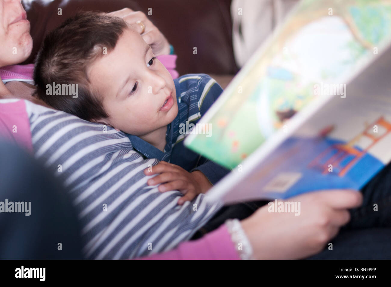 Mother reading bedtime stories to child Stock Photo - Alamy