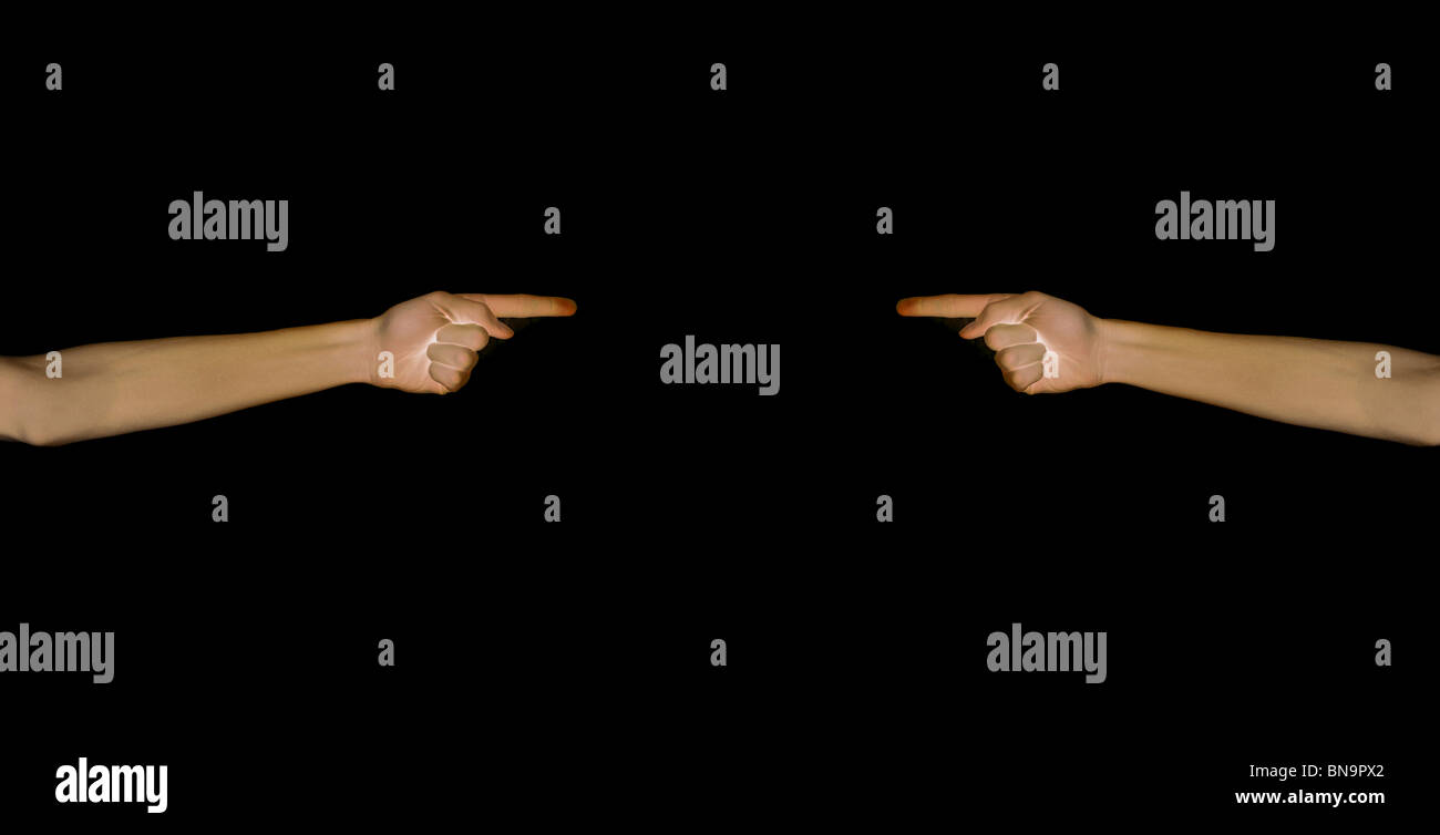 Two hands pointing isolated on black Stock Photo - Alamy