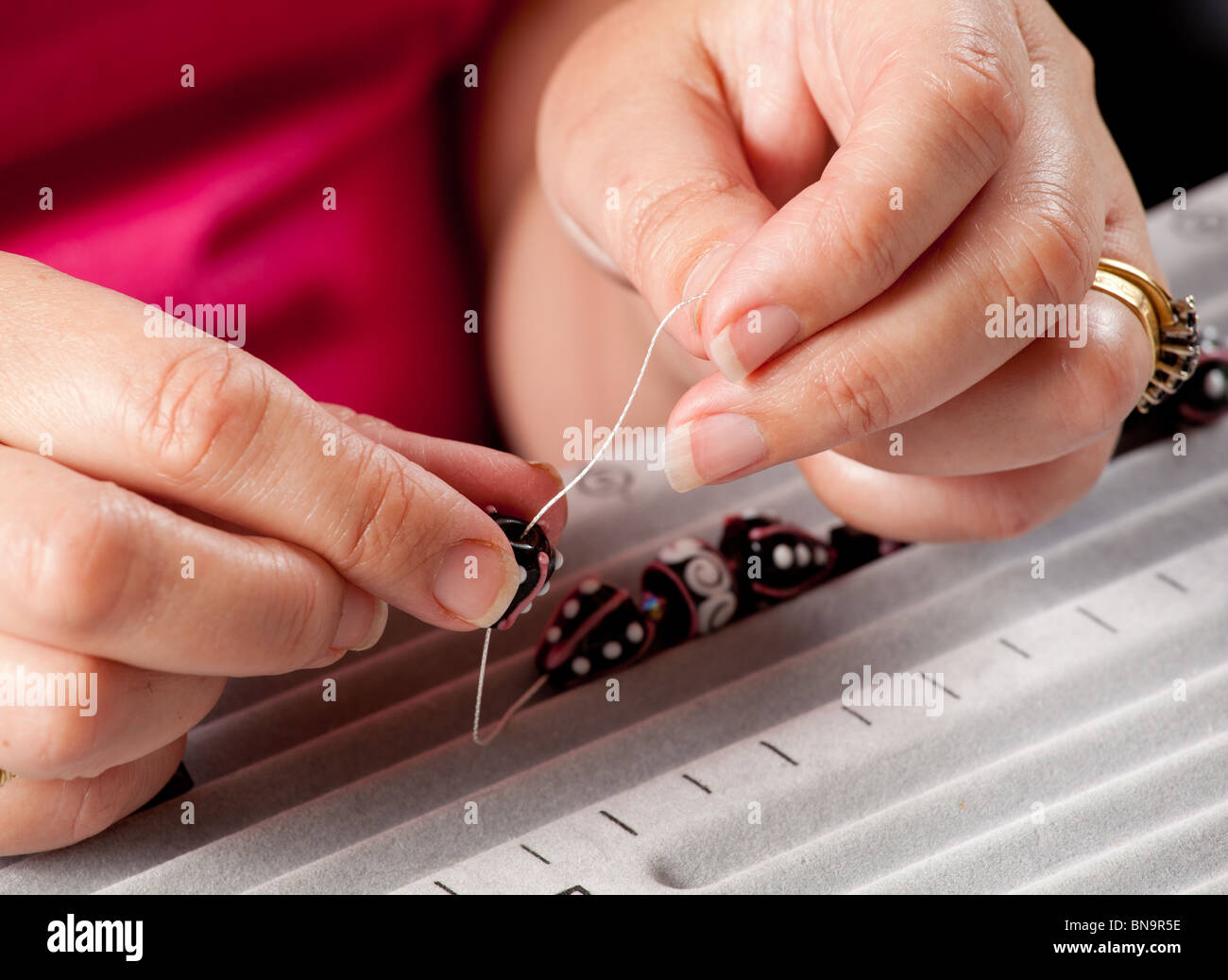 Threading beads hi-res stock photography and images - Alamy