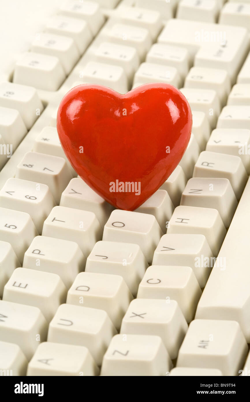 Red Heart Shape and computer keyboard Stock Photo - Alamy
