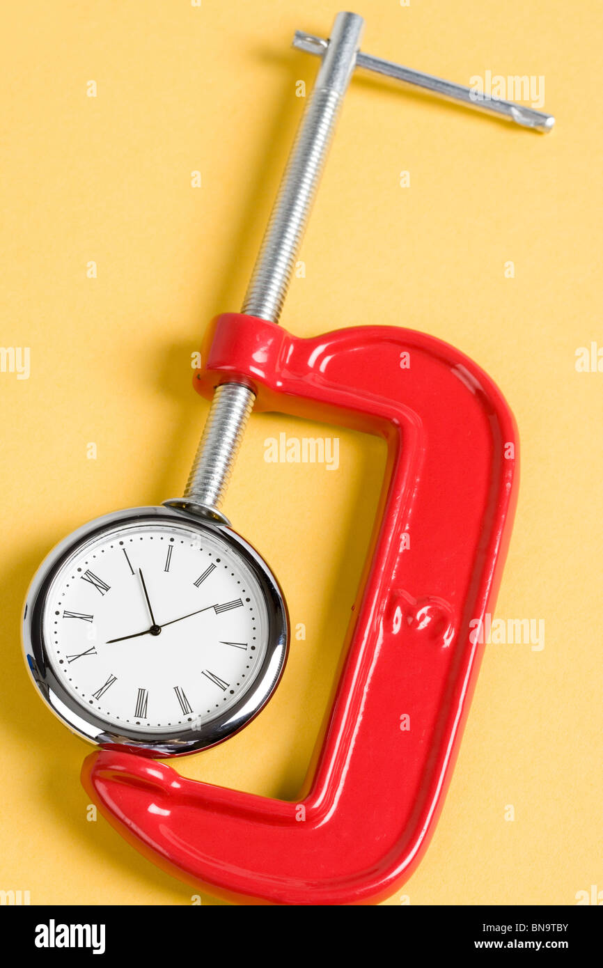 Vise Grip and Clock, Concept of busy Stock Photo - Alamy