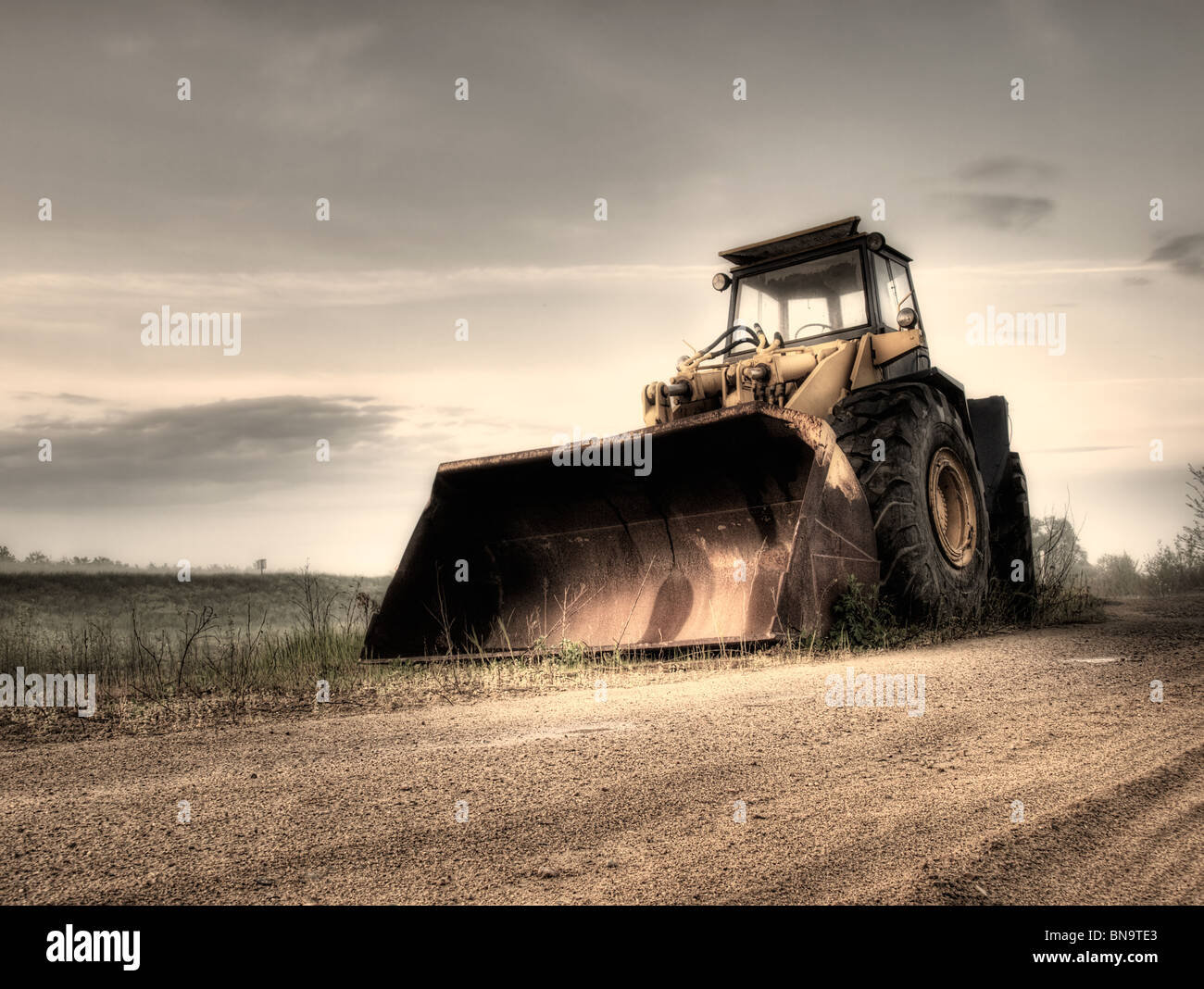 Big bulldozer at the building site.Monochrome toned Stock Photo - Alamy