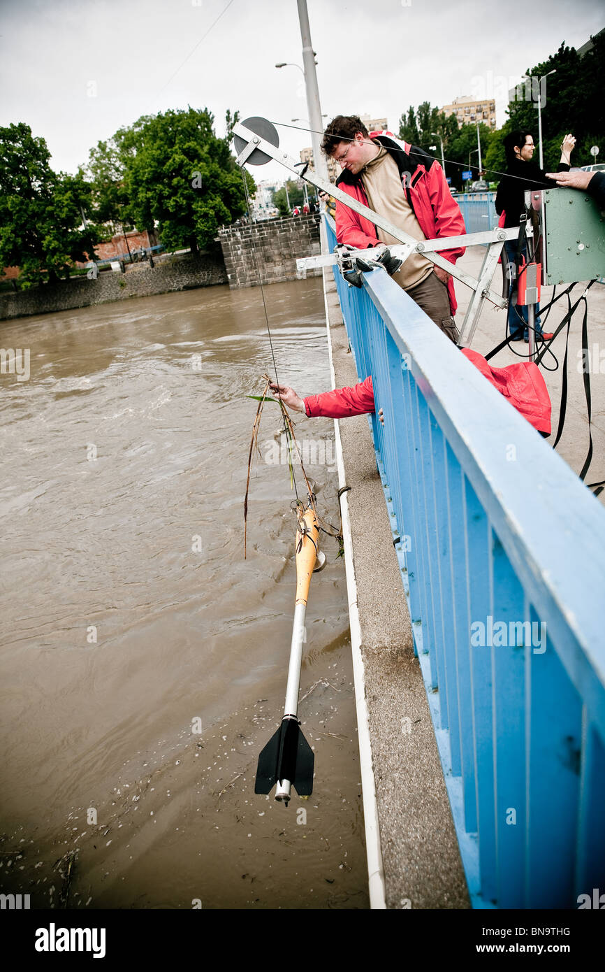 Engineer measures the level of the river Stock Photo - Alamy