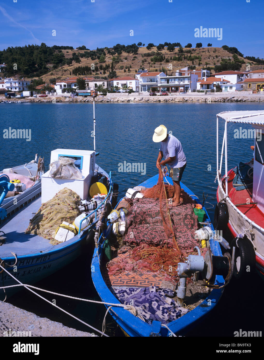 Kassandra Peninsula - Typical Greek fisherman tending to his nets in ...