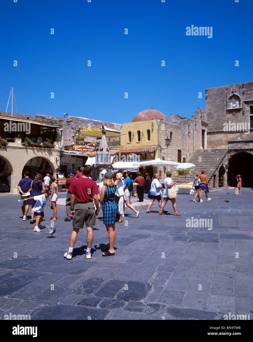 Visitors in Old Rhodes Town Square Stock Photo - Alamy