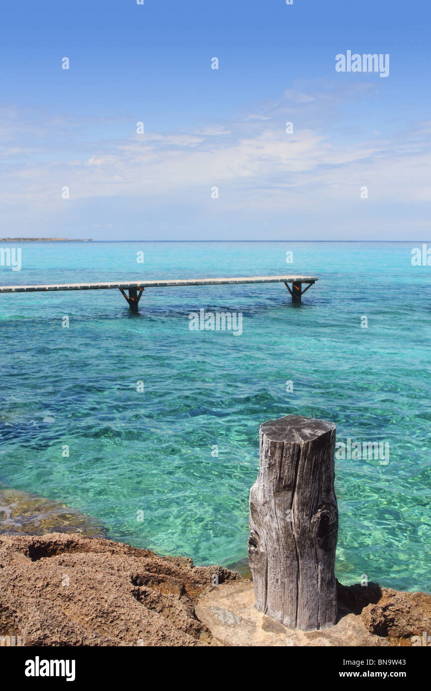 Formentera Illetes turquoise sea wooden pier aged trunk Illetas Stock ...