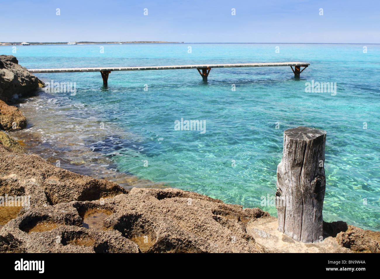 Formentera Illetes turquoise sea wooden pier aged trunk Illetas Stock ...