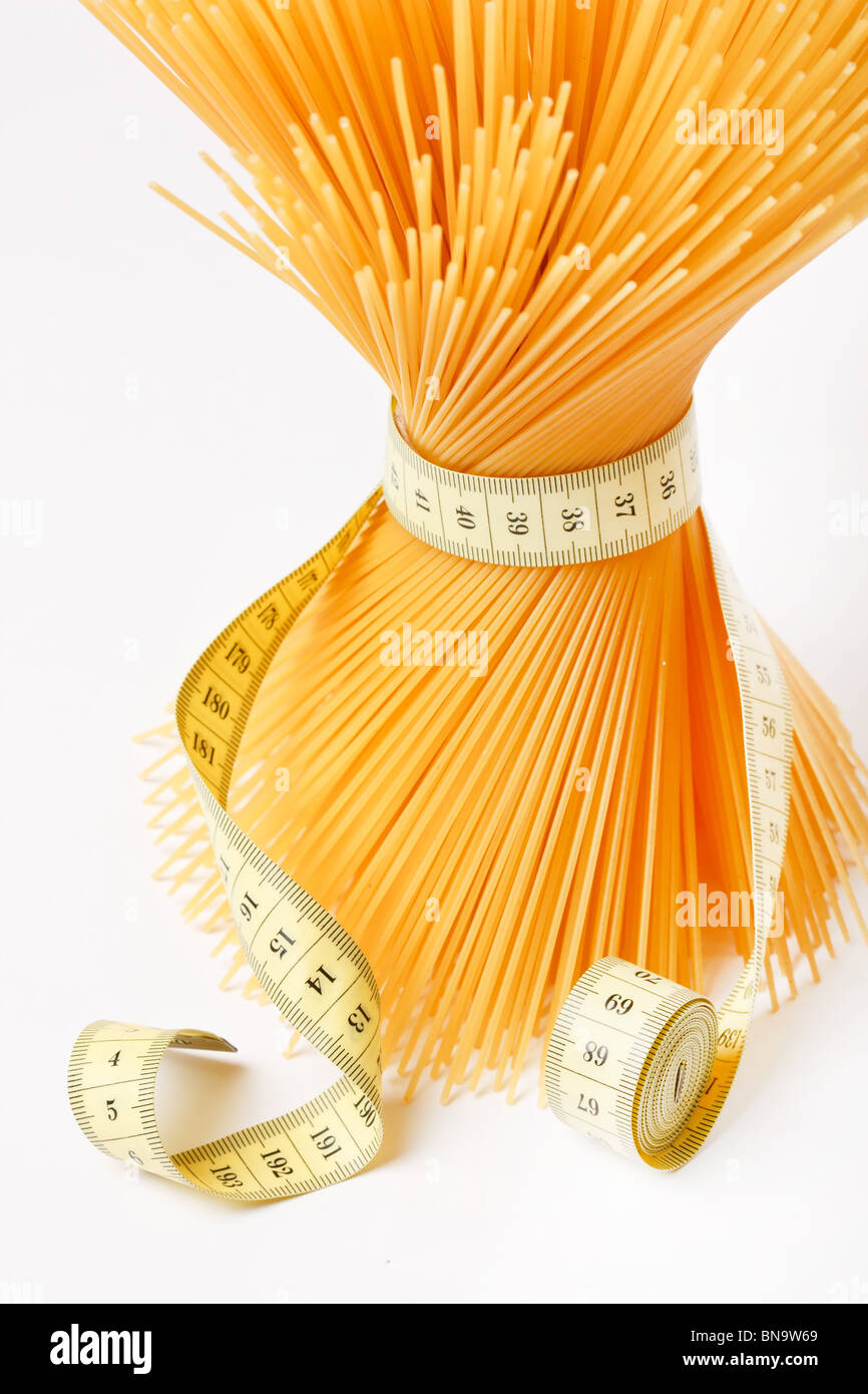 Spaghetti with measuring tape Stock Photo - Alamy