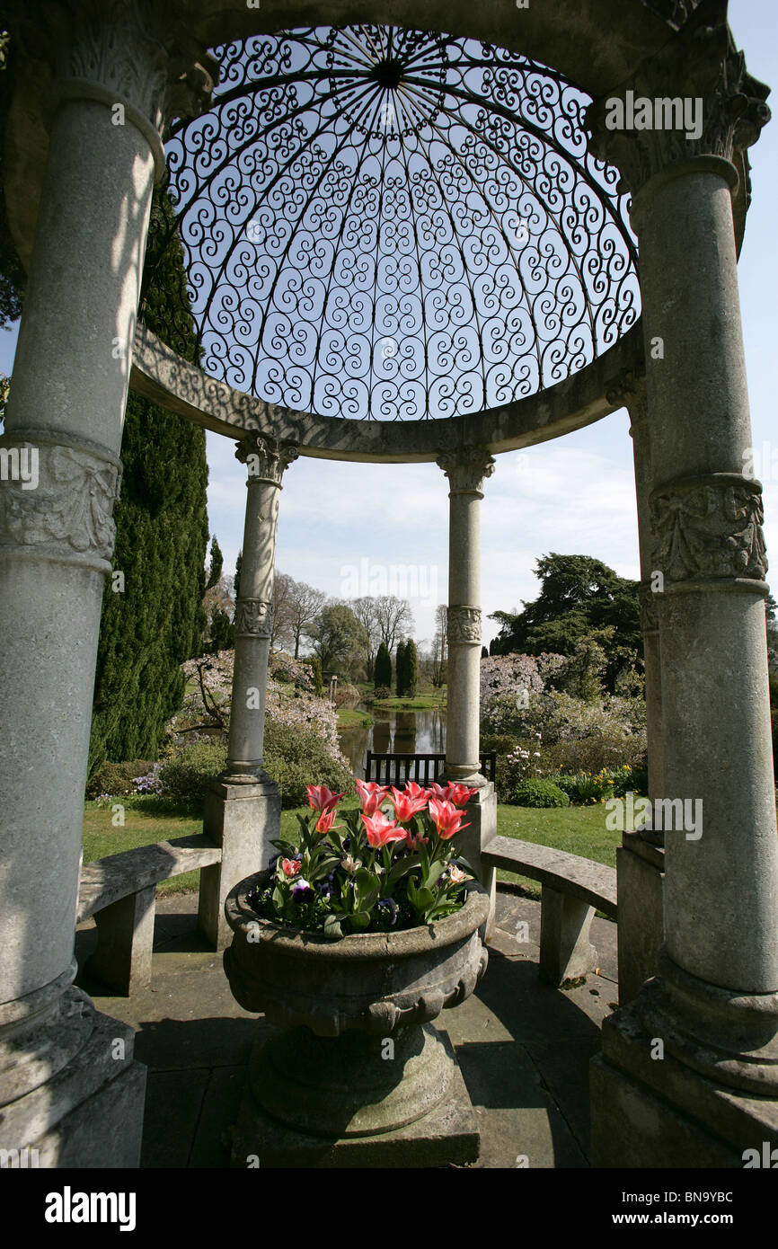 Cholmondeley Castle Gardens. Stone arbour with tulips in full bloom in ...