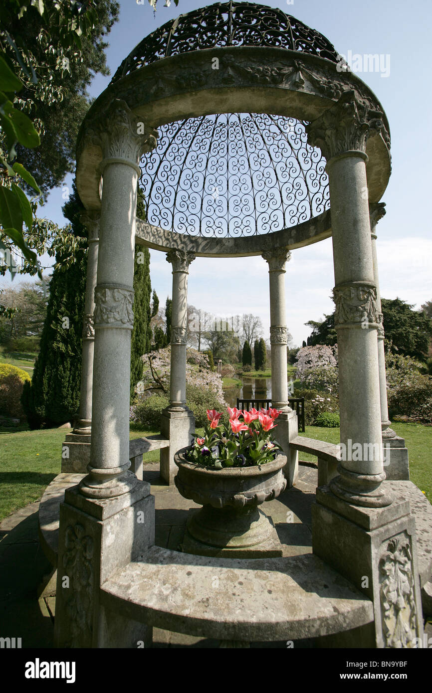 Cholmondeley Castle Gardens. Stone arbour with tulips in full bloom in ...