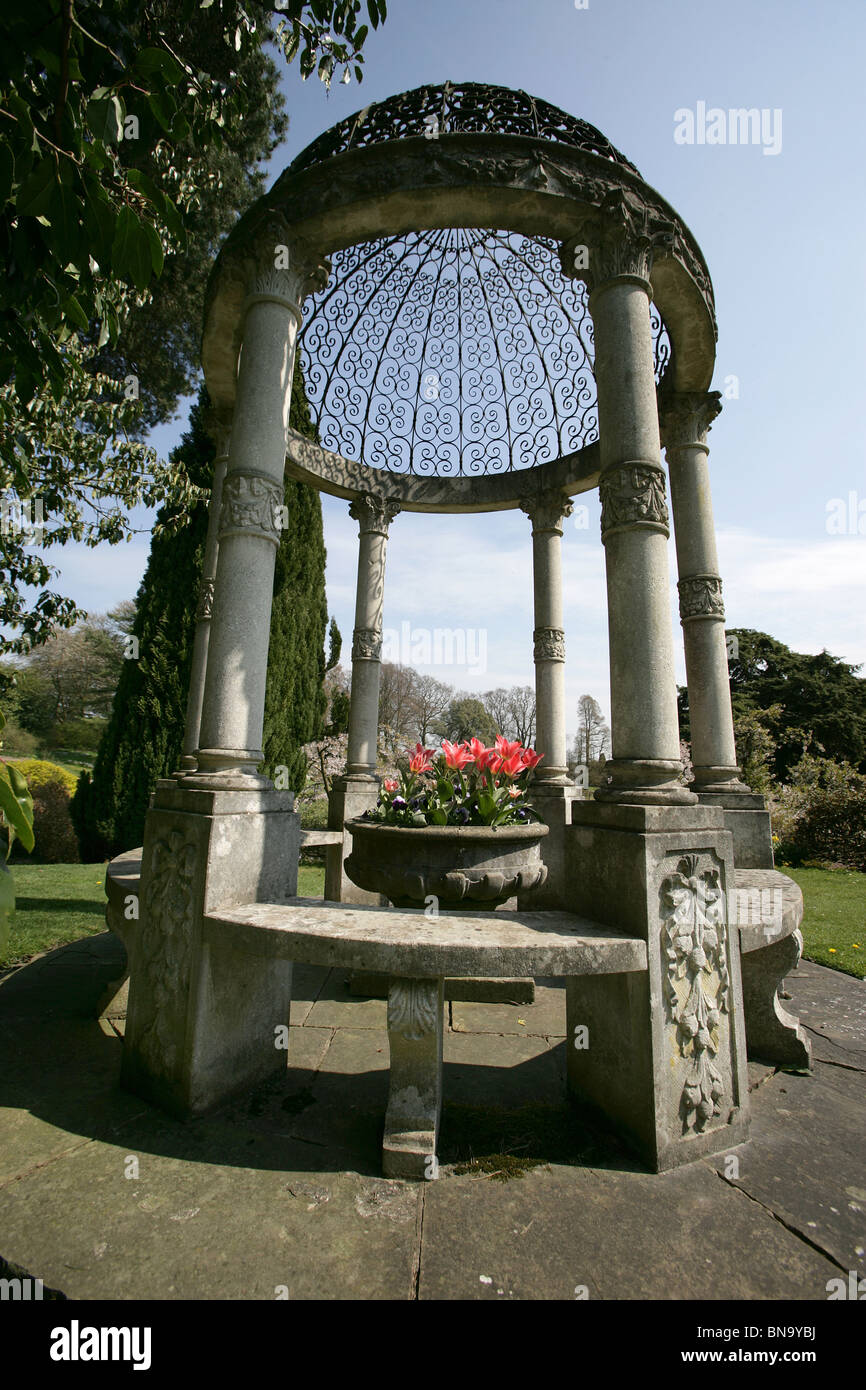 Cholmondeley Castle Gardens. Stone arbour with tulips in full bloom in ...