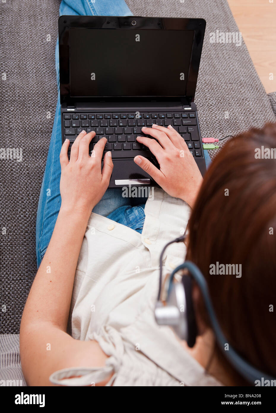 Beautiful woman at home with a laptop, and speaking over the Internet ...
