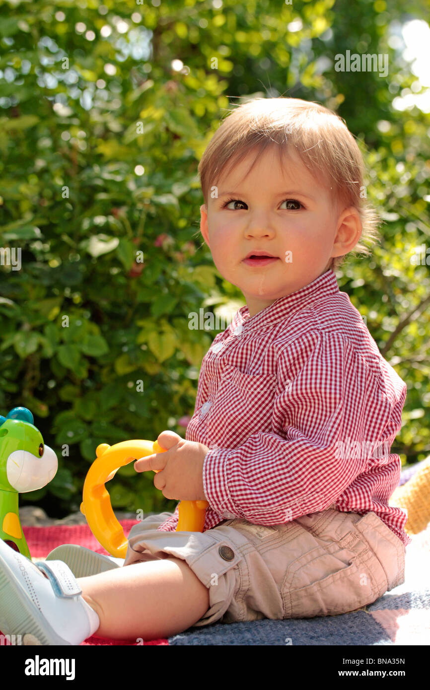 Toddler with toys white background hi-res stock photography and images ...