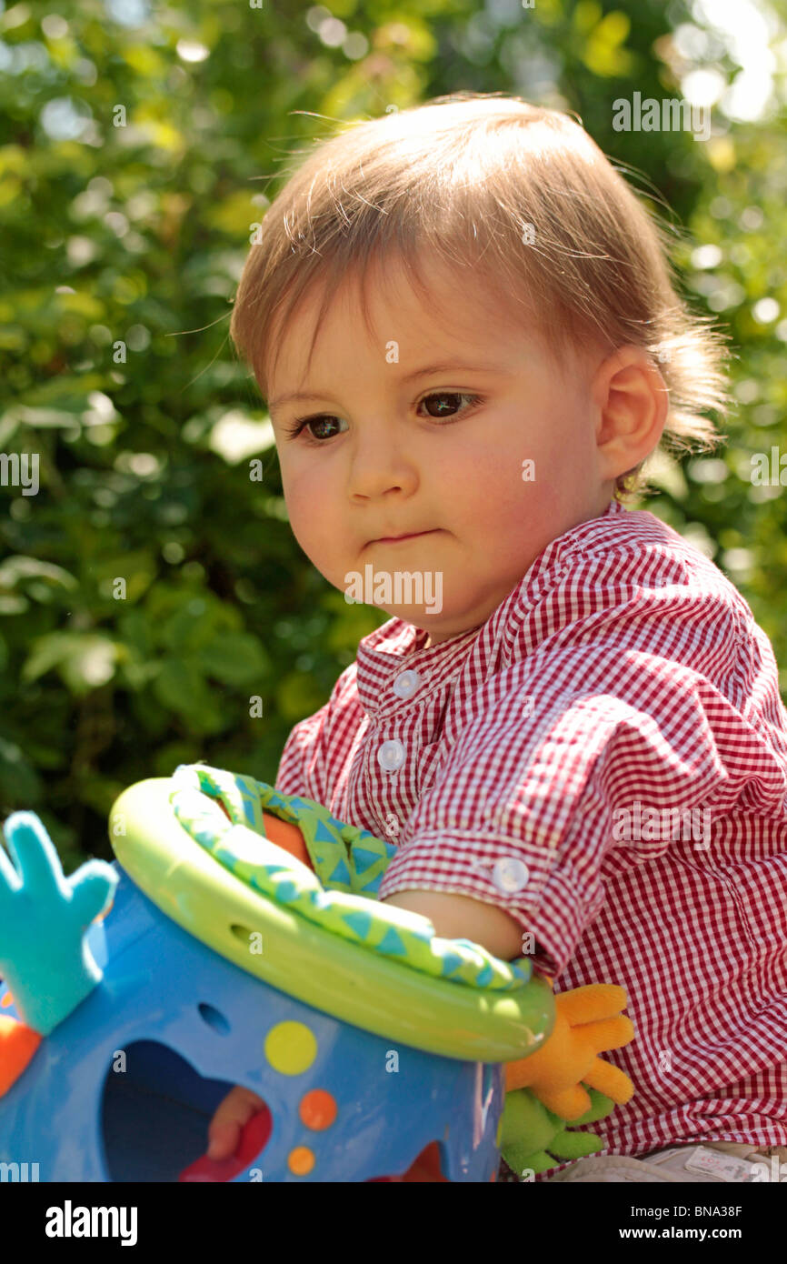 Toddler with toys white background hi-res stock photography and images ...