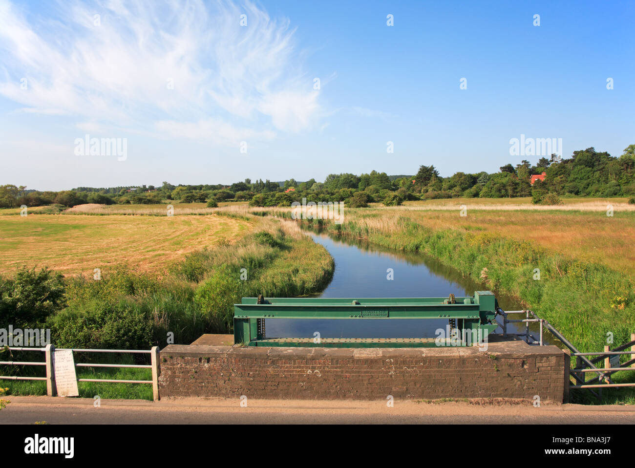 The River Glaven and flood control sluice on the A149 coast road at ...