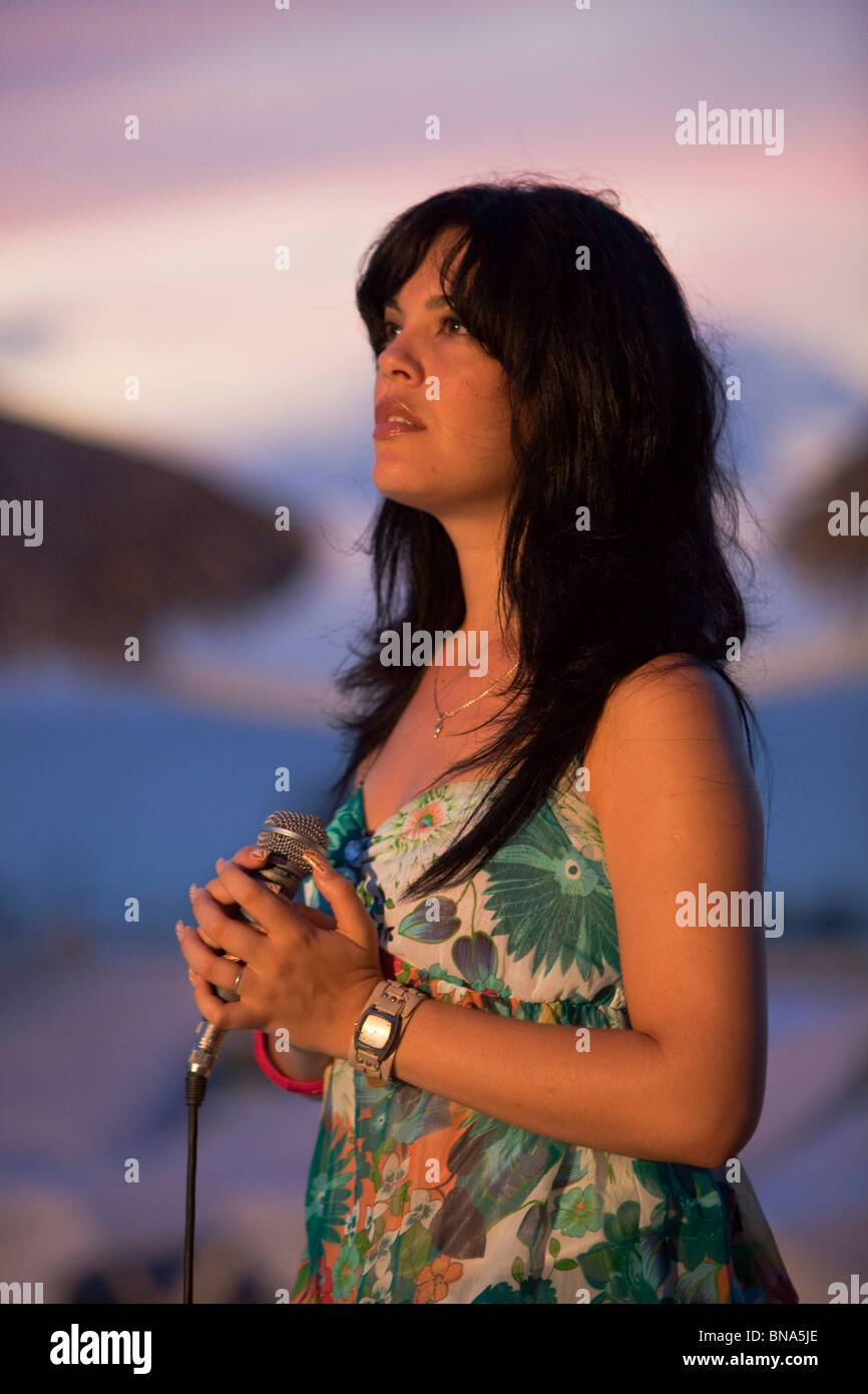 female vocal singer, sun set background Stock Photo - Alamy