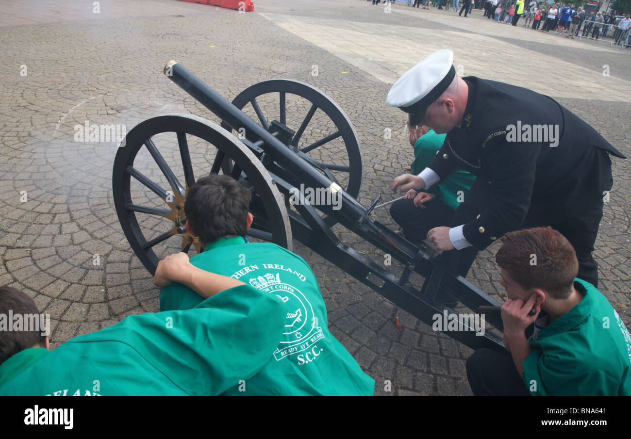 senior officer firing gun as part of northern ireland sea cadets field ...