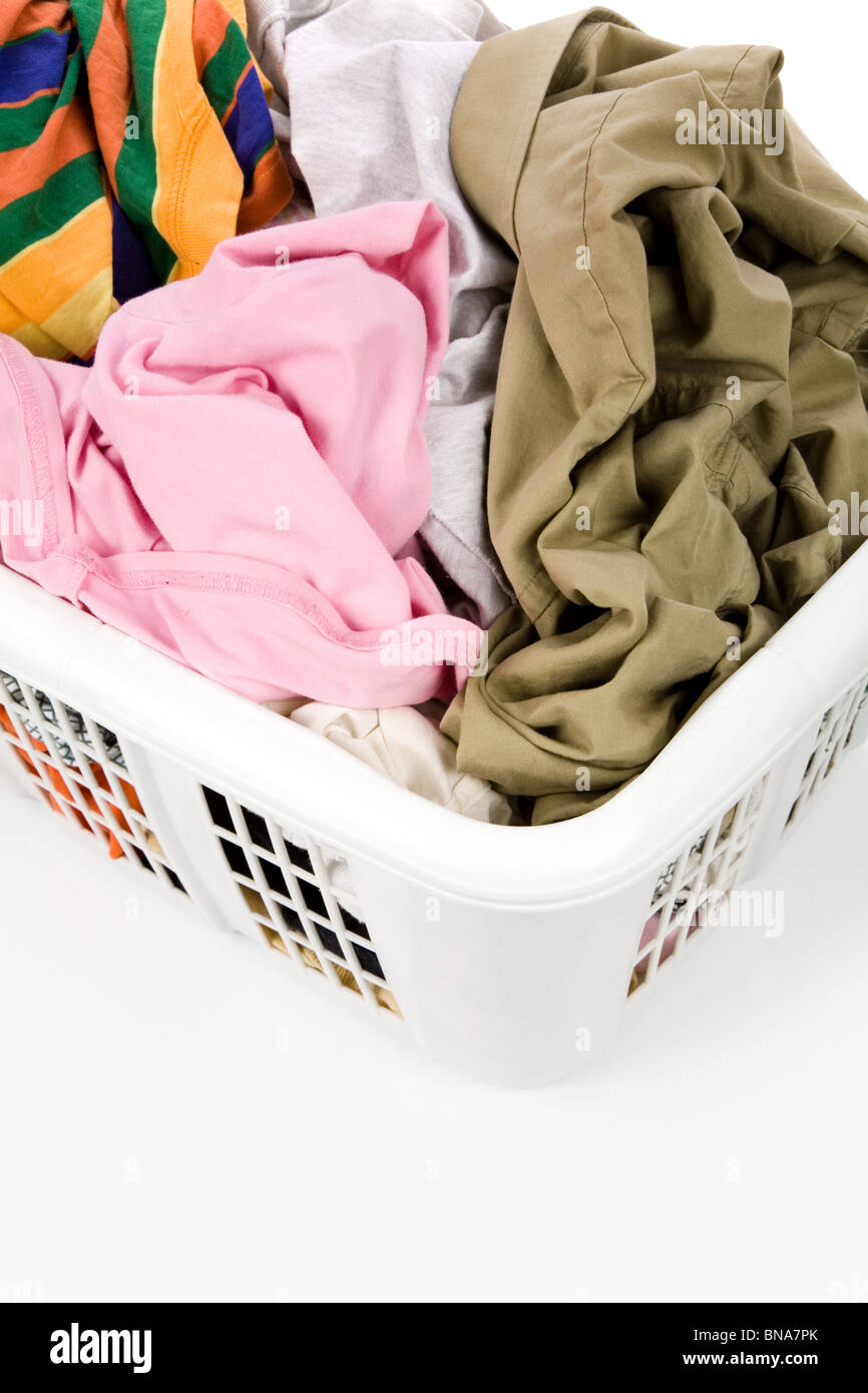 laundry basket and dirty clothing with white background Stock Photo - Alamy