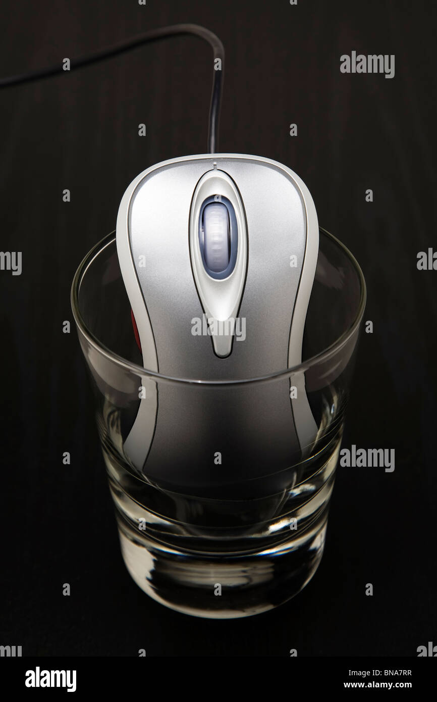 Computer mouse in a glass Stock Photo - Alamy