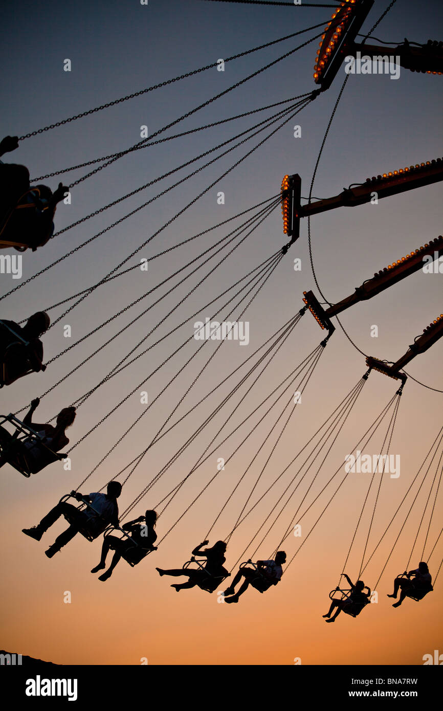 Carnival swing ride is silhouetted during Sunset at Family Kingdom ...